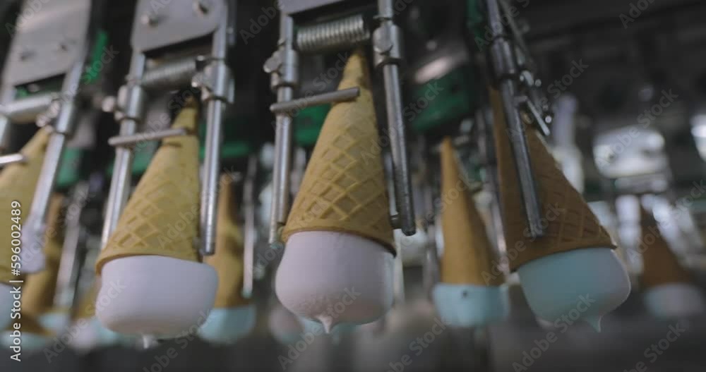 Automated ice cream production line. Ice cream on the conveyor line ...