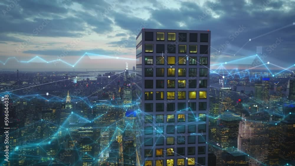 Fly around tall skyscraper with lighted windows at twilight. Aerial ...