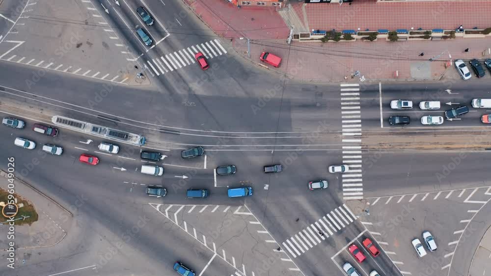 Aerial view from a drone of a road intersection in the city with cars ...