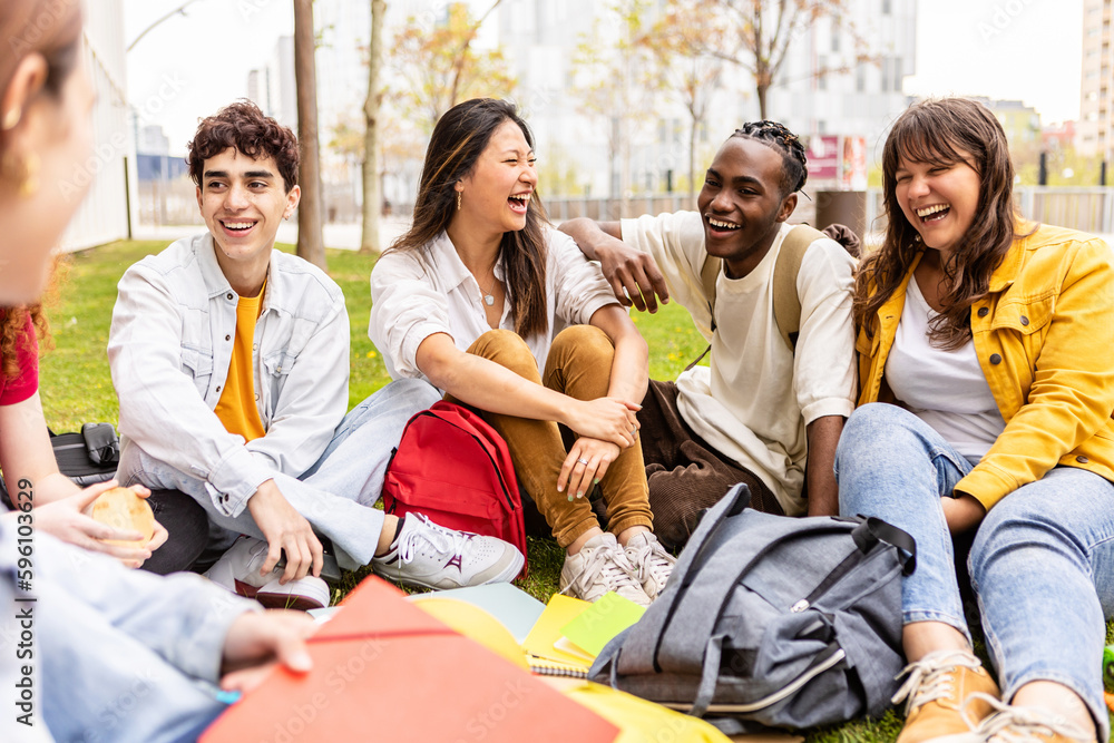 Young group of multiracial students laughing and having fun together ...