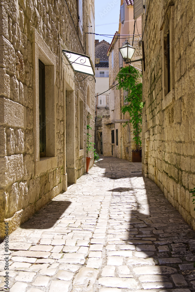 Narrow street with stone houses. Old houses and old narrow alley in ...