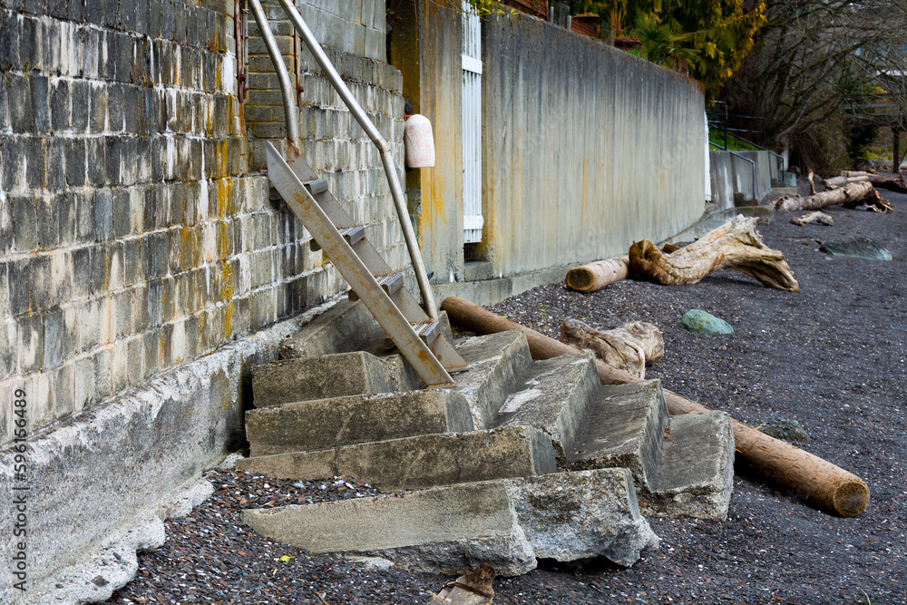 An image of a concrete staircase which has collapsed and sunk into the ...