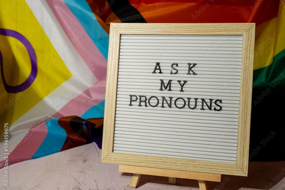 ASK MY PRONOUNS text Neo pronouns concept on Rainbow flag background ...