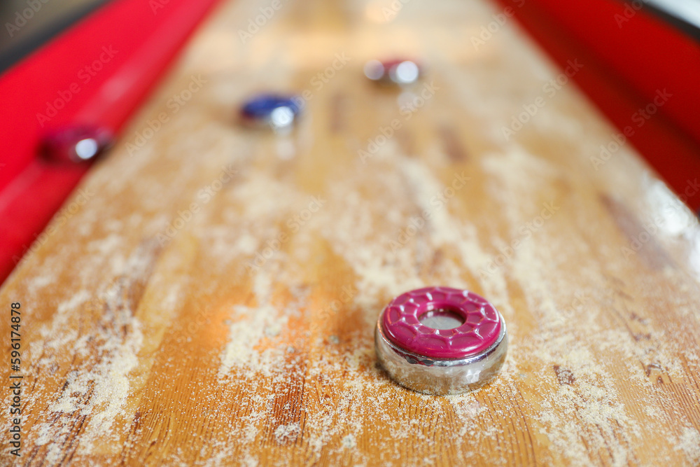 Shuffleboard is a game of precision and strategy, where players slide ...