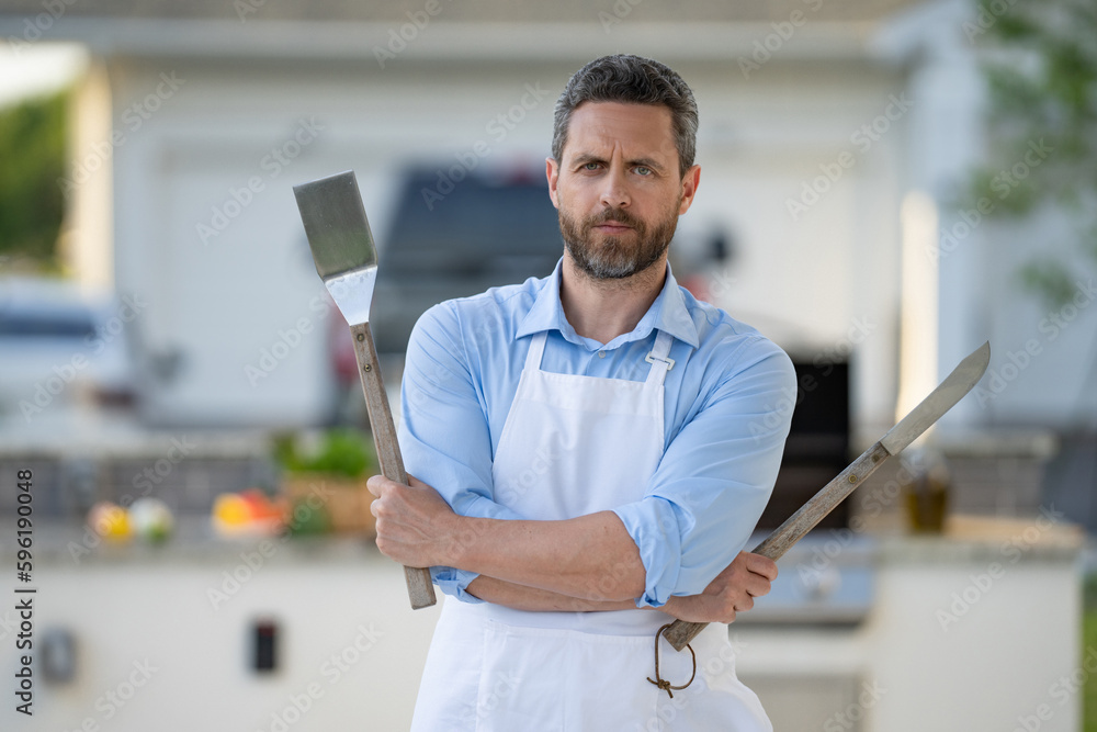 portrait of chef man at barbecue and grill outdoor. photo of chef man ...