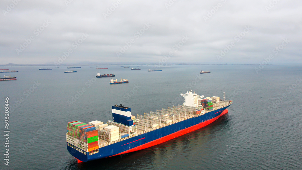 Aerial view of blue hull color ultra large container ship in discharged ...