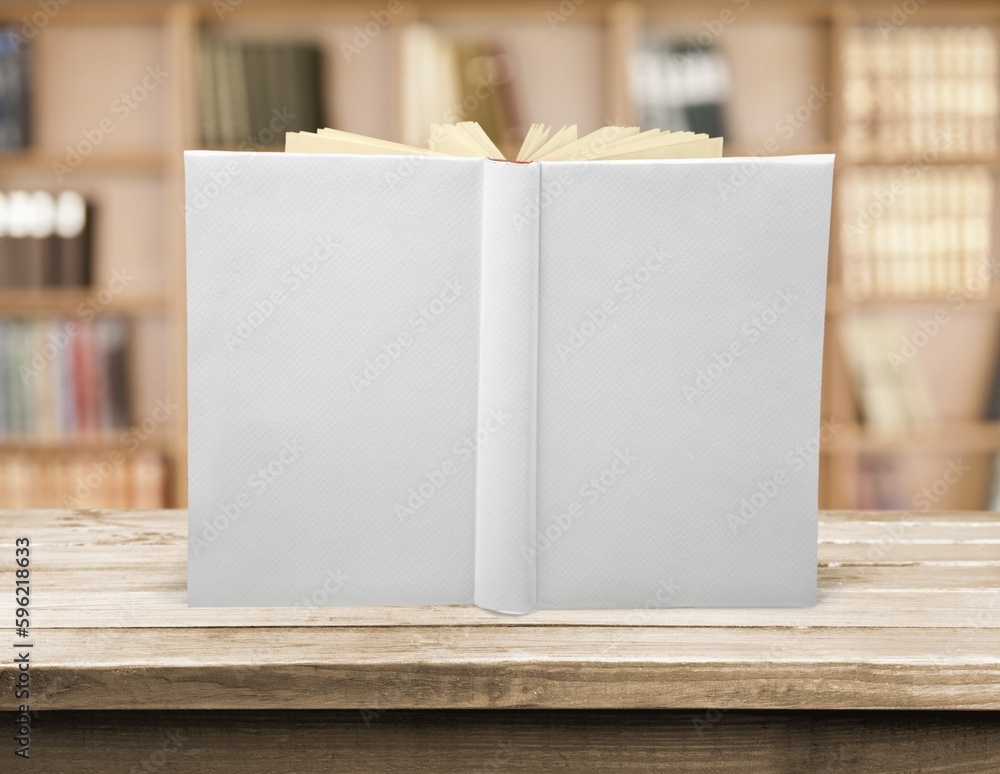 Blank white book mockup on wood desk Stock Photo | Adobe Stock