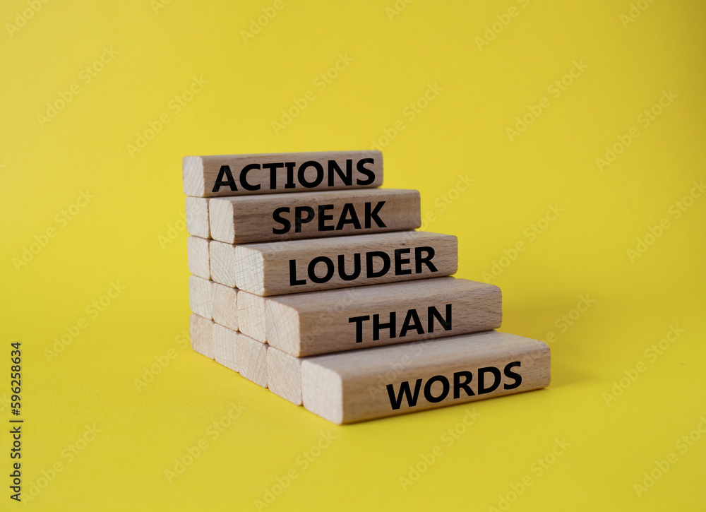 Actions speak louder than Words symbol. Wooden blocks with words ...