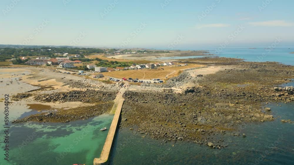 Forward drone flight over bay and promontory flying over crystal clear ...