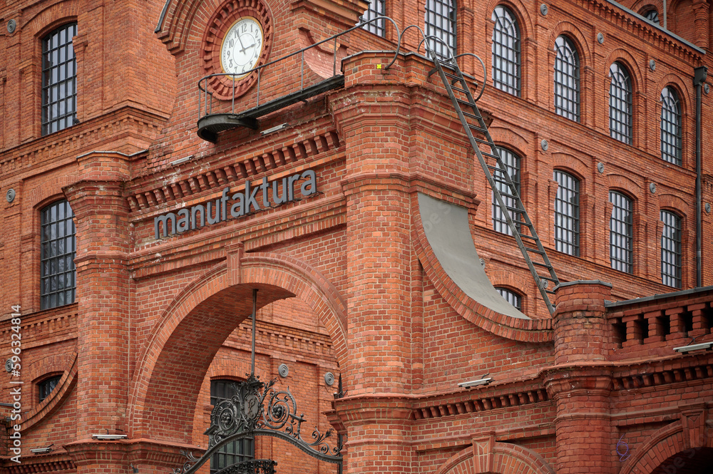 Renovated buildings of textile industry halls. The famous entrance gate ...