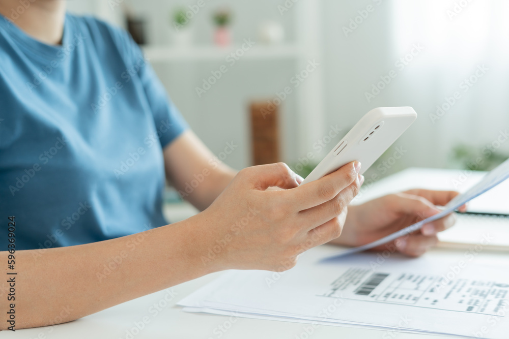 woman use phone scan barcode or QR codes to pay credit card bill after ...