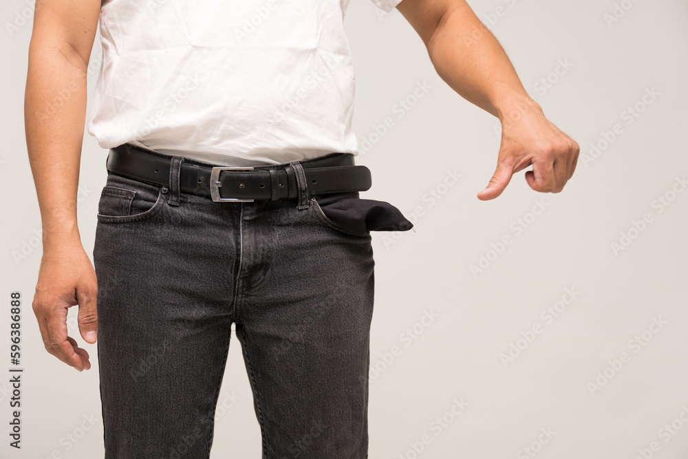 Black jean man turning his empty pockets inside out isolated on white ...