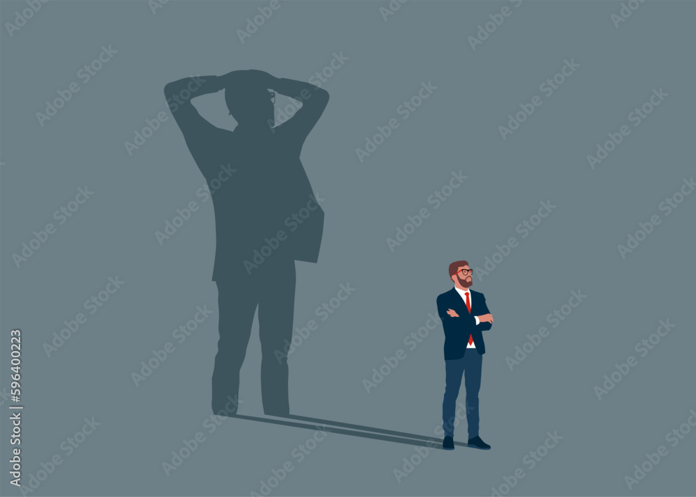 Confident businessman standing with fear shadow. Lack of self ...