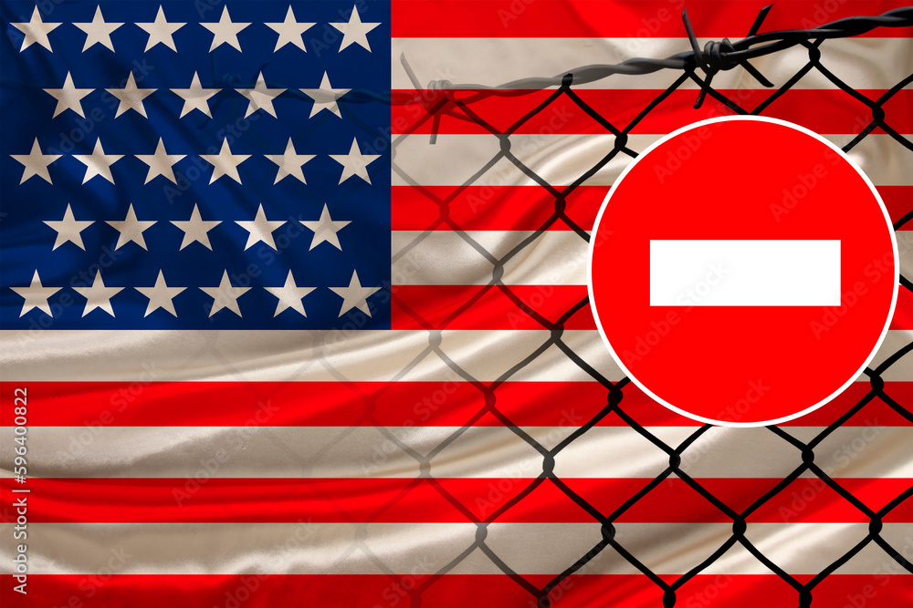 usa national flag on satin, fence with barbed wire, symbolic red sign ...