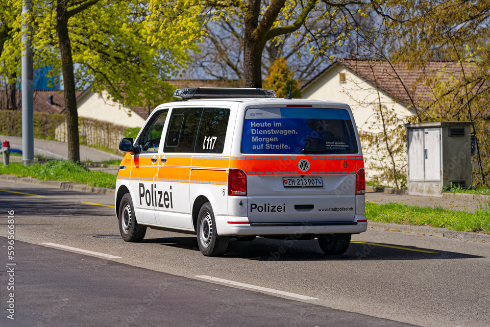 White and orange VW transporter police van on patrol at City of Zürich ...