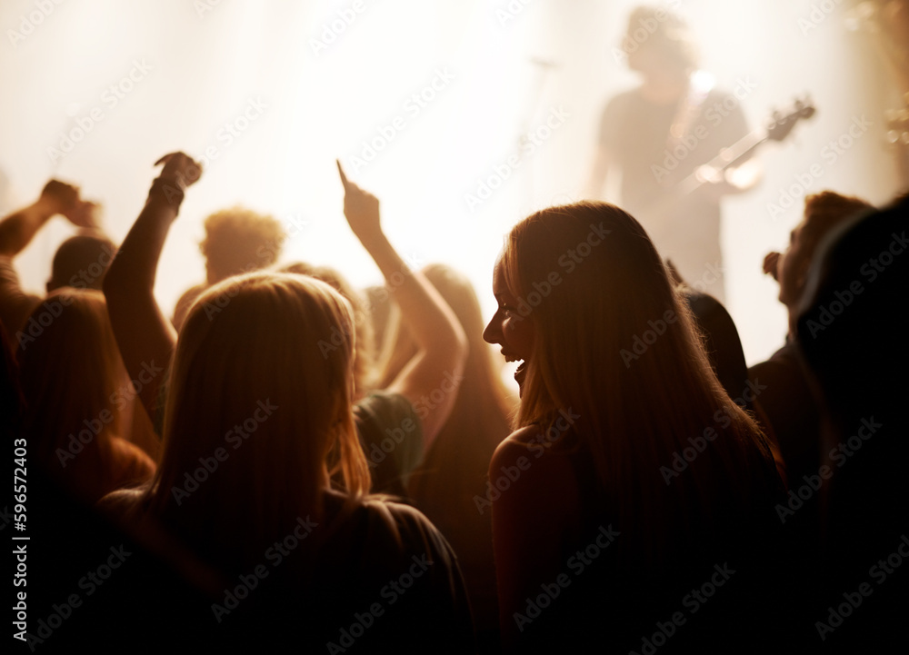 Excited women, friends and fans at music festival, lights and crowd in ...