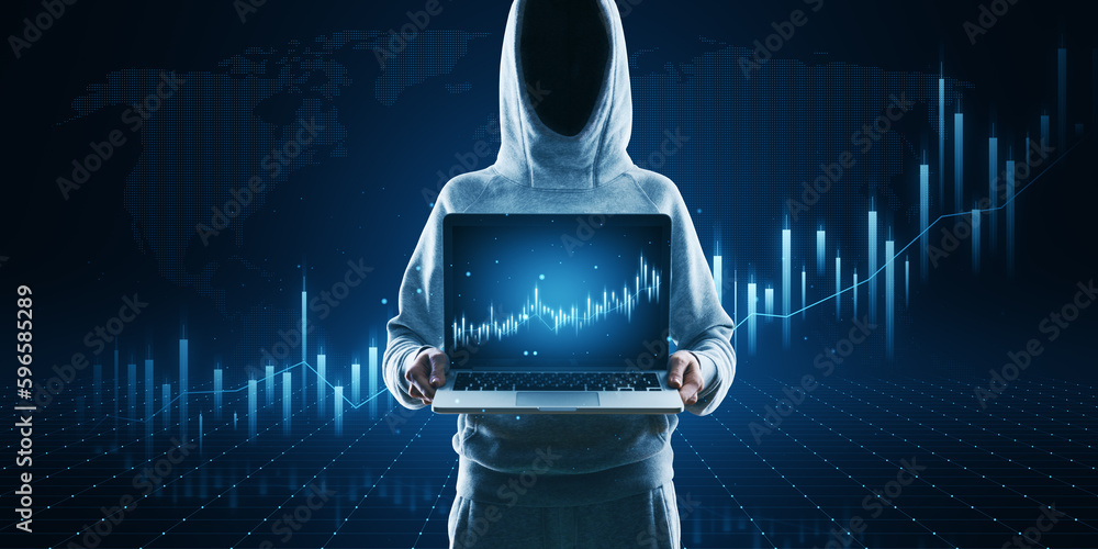 Hacker holding laptop with growing business chart on blurry background ...
