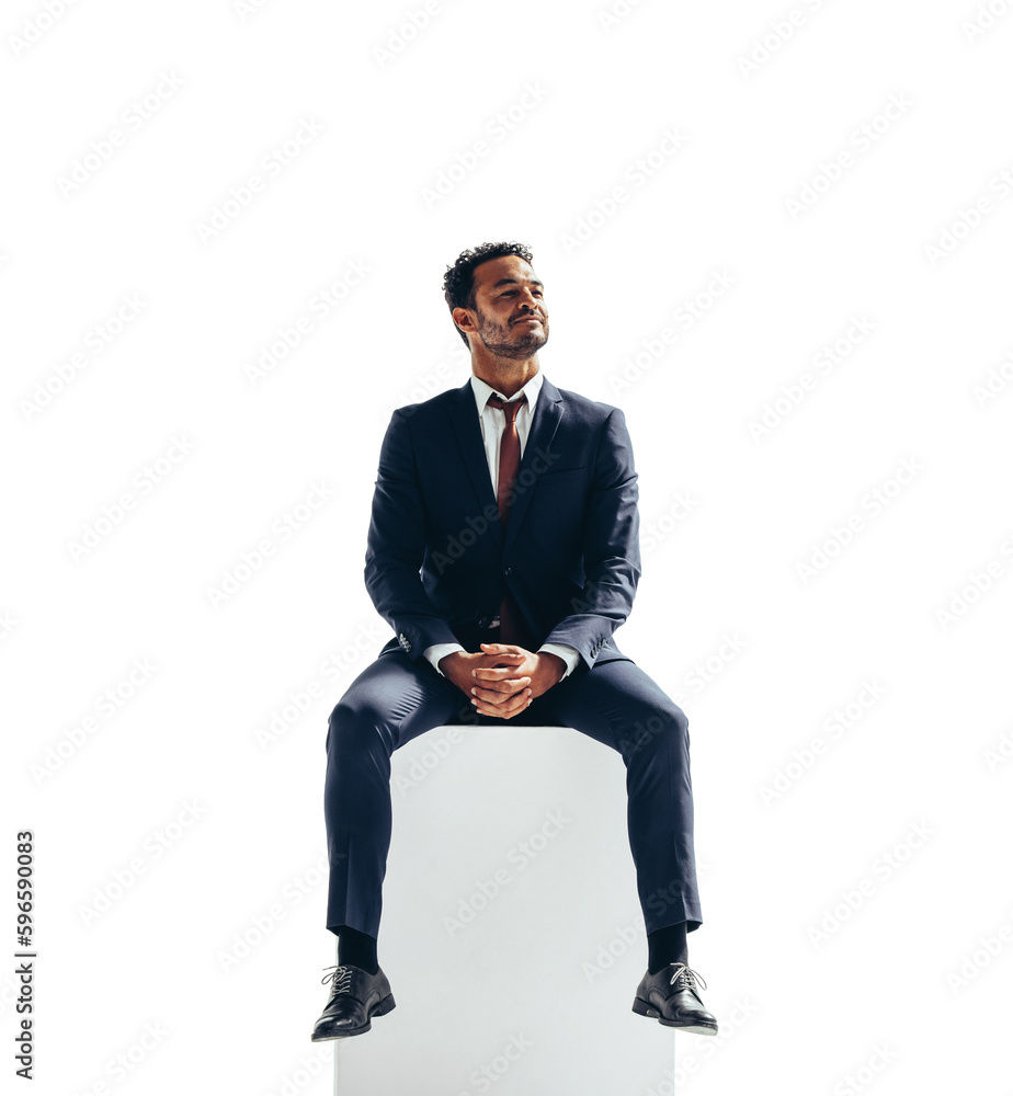 Contemplative businessman sitting on top of a block on a transparent ...
