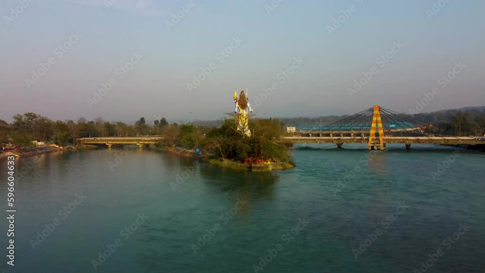 hindu god shiva statue and isolated cable bridge over ganges river from ...