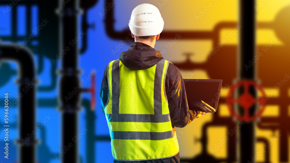 Man engineer. Guy looks at pipes. Engineering contractor. Worker with ...