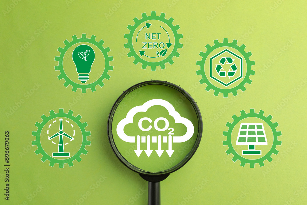 Green energy concept.,Reduce Co2 icon on magnifying glass among green energy icon over green ...
