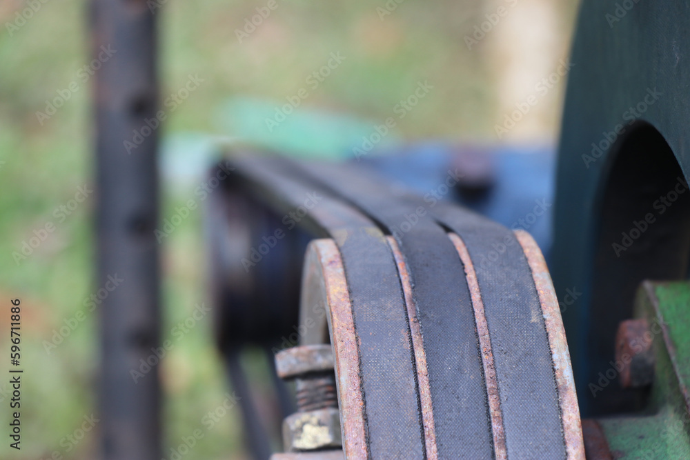 Closeup of a Belt drive transmission used to transmit force from diesel ...