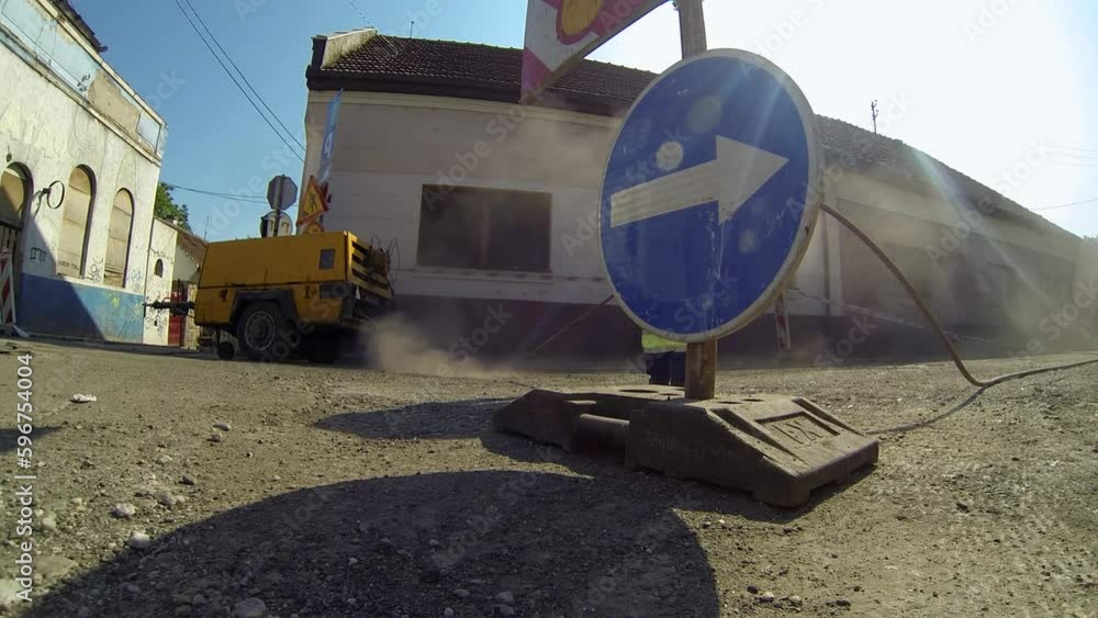Worker Using Compressed Air for Road Cleaning at Road Construction Site ...