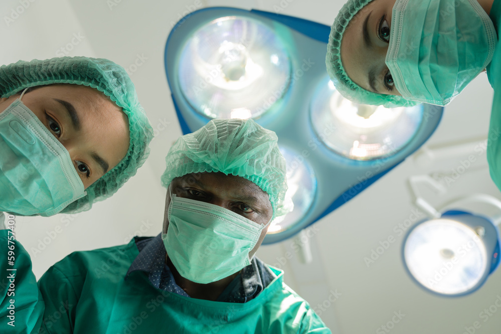 Medical urgency in the ambulance. Emergency doctor using defibrillator ...