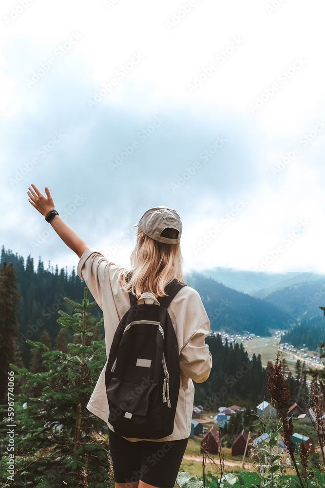 Travel. Girl travels through the mountains glamping, tents,waterfalls ...