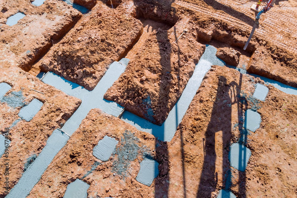 When constructing house foundations are poured using an automatic pump ...