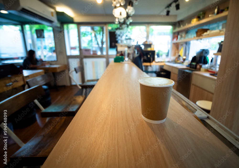 One Coffee cup paper placed on a wooden table, in a cafe coffee shop ...