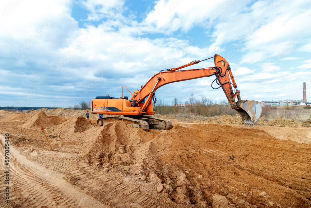 Excavator dig the trenches at a construction site. Trench for laying ...