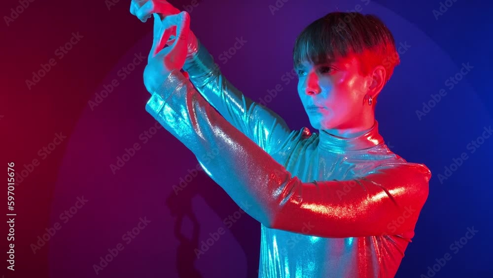 Concentrated young adult woman making viewfinder hand gesture in ...