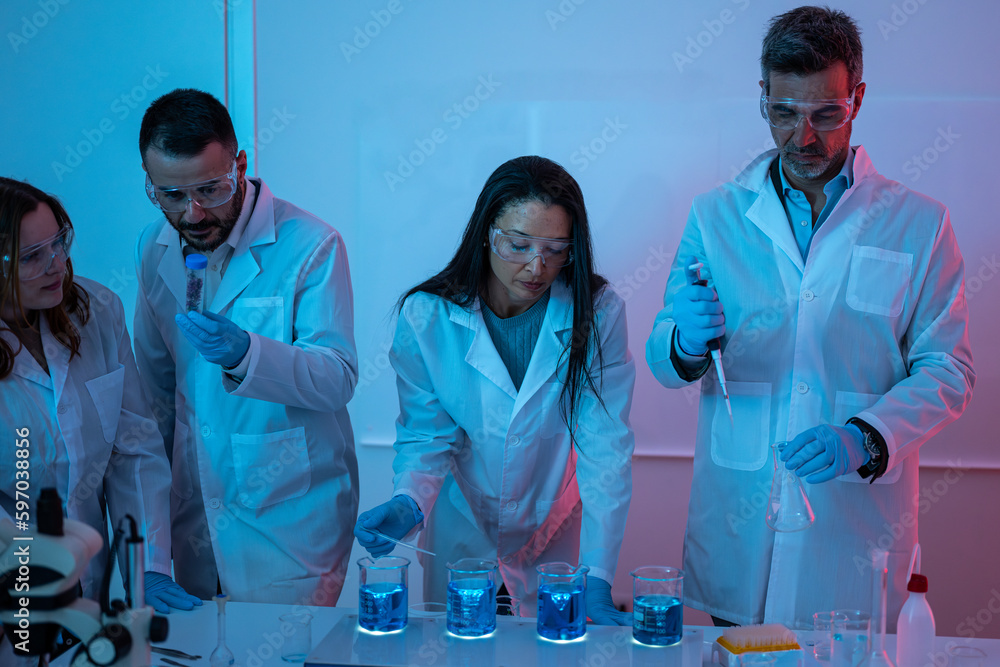 Medical development laboratory, scientist using pipette and making ...