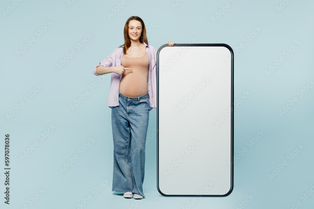 Full body young pregnant future mom woman with belly tummy with baby in casual clothes show big ...