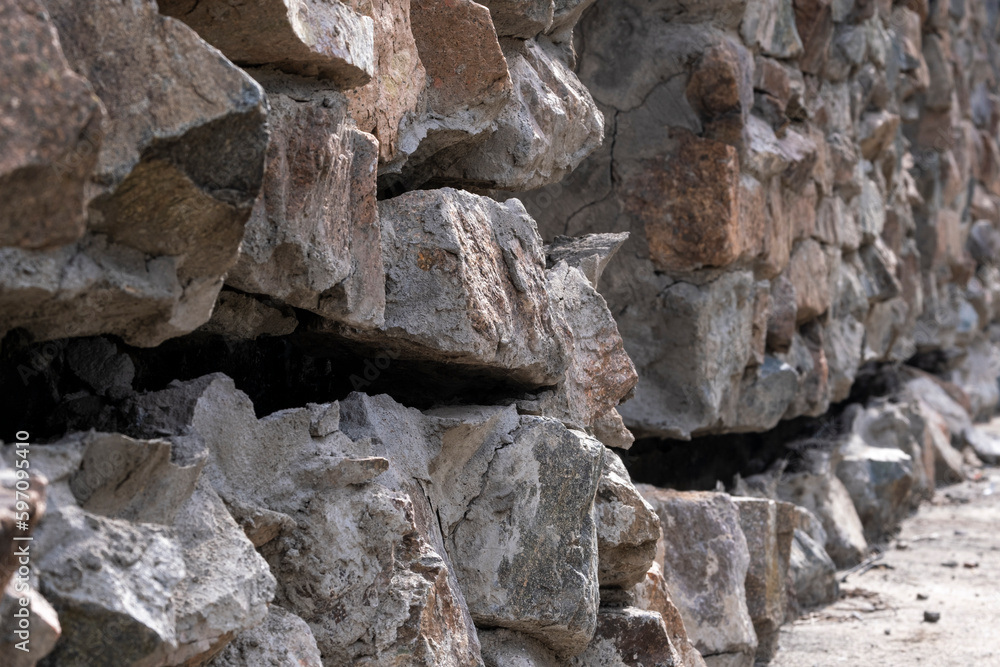 Deep crack in the cladding of the foundation of the building. Crack in ...