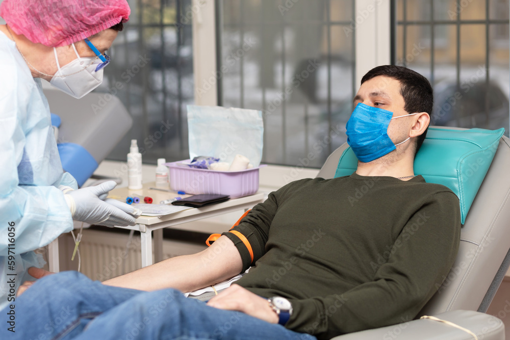 man donor in medical mask for bone marrow donation blood in laboratory ...