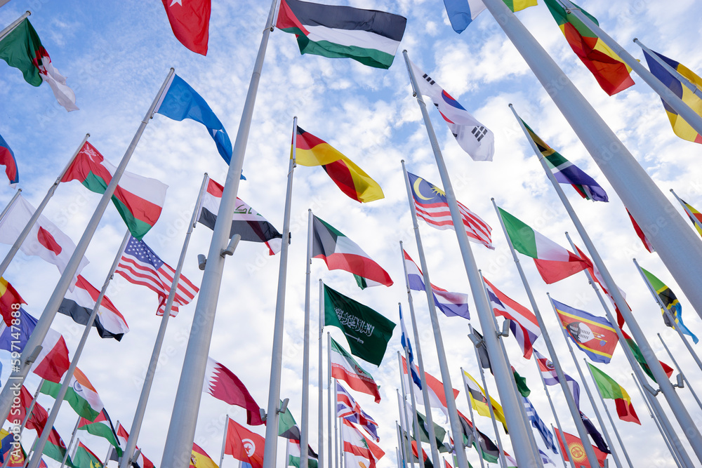 Doha, Qatar - April 25, 2023: Flags of countries in the old port of ...