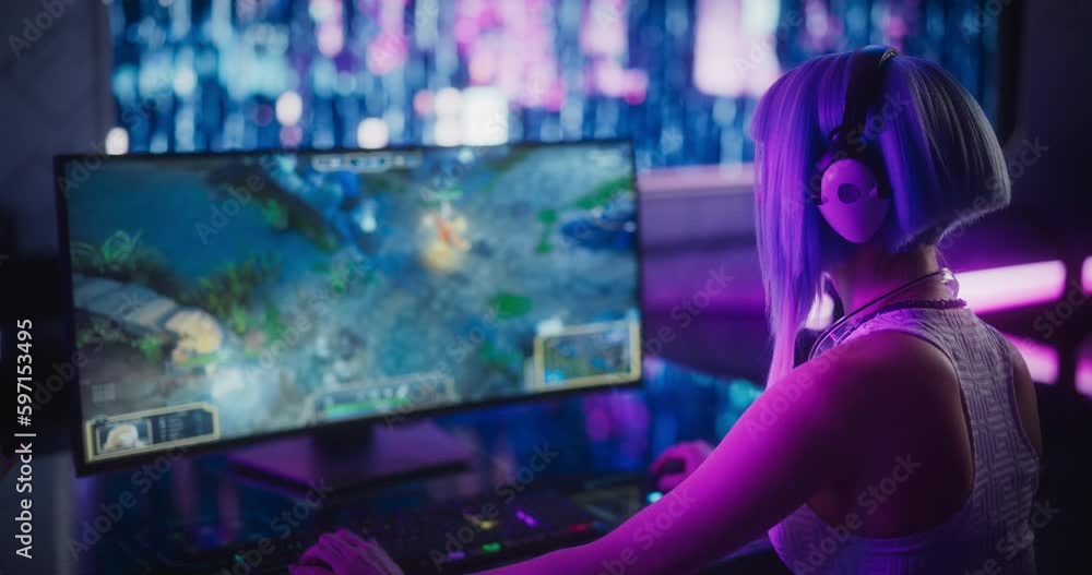 Young Female Gamer Playing Strategy Video Game with Modern Graphics on ...