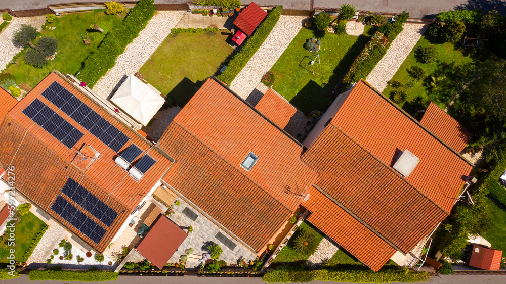 Aerial perpendicular view on small terraced villas built in a ...