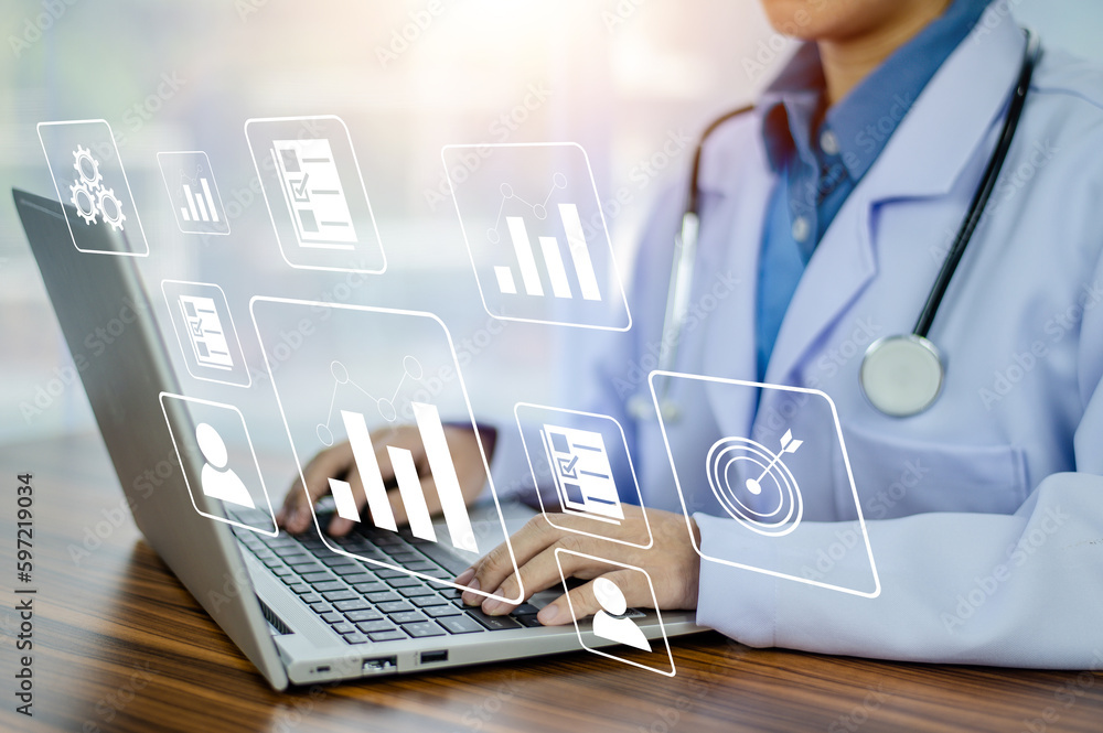 Doctor using computer Document Management System (DMS), online ...