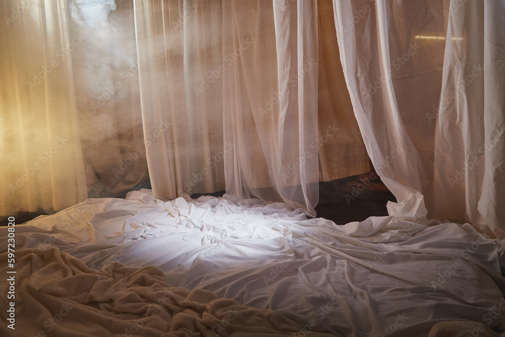 Light, soft transparent curtains in room. Canopy around bed with gentle ...