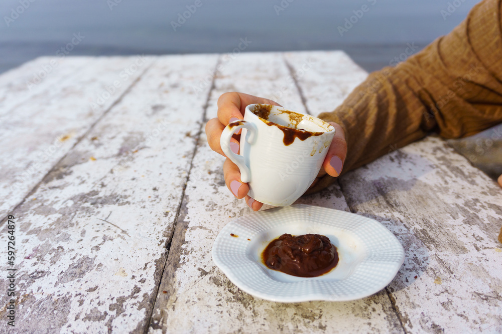 Fortune telling with Turkish coffee concept at seaside, woman telling ...