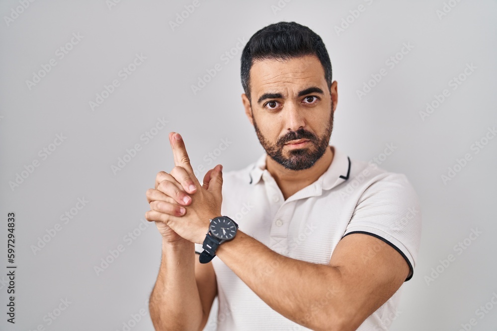 Young hispanic man with beard wearing casual clothes over white ...