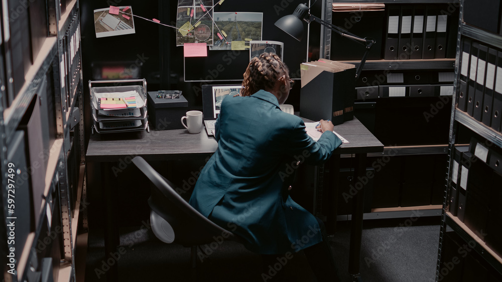 Private agency detective conducting investigation with map and ...