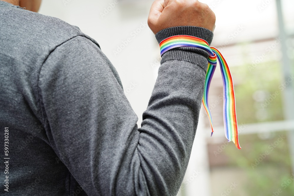 Asian woman with rainbow flag, LGBT symbol rights and gender equality ...