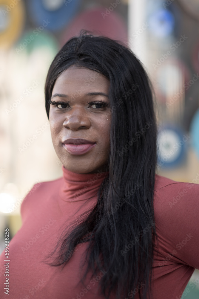 Wearing a sleek, long-sleeved turtleneck, a model expresses a classic ...