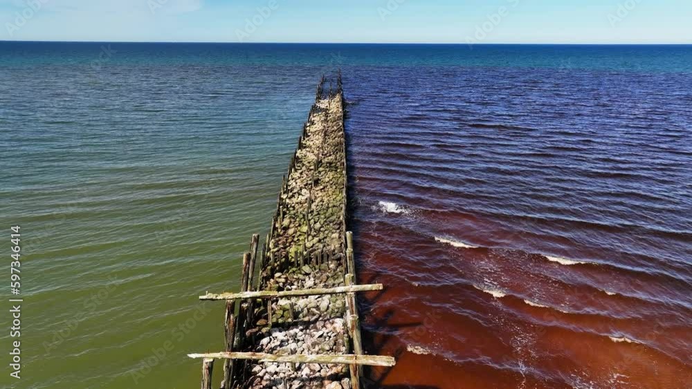 Once there was an old stone and wooden stilt bridge to the sea; now the ...