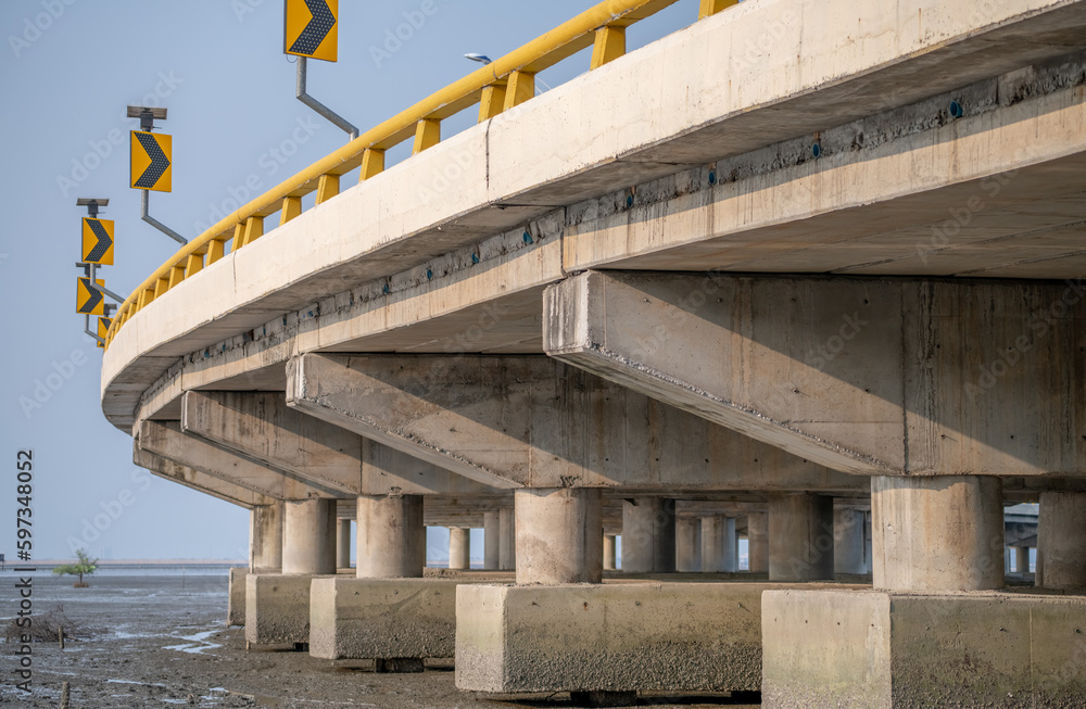 Structure of reinforced concrete bridge along the sea. Bottom view of ...