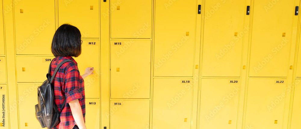 Self-service storage locker. Tourist uses the service of automated ...